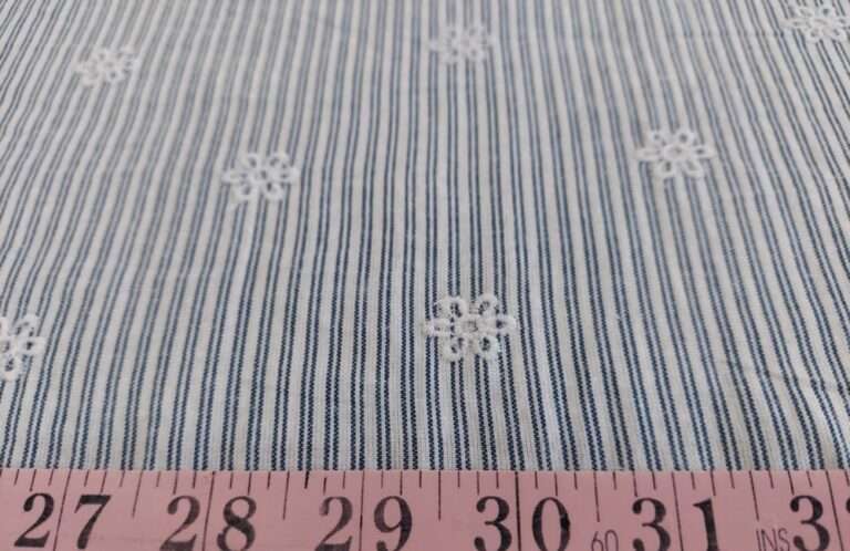 Striped fabric with embroidered flowers, perfect for vintage clothing